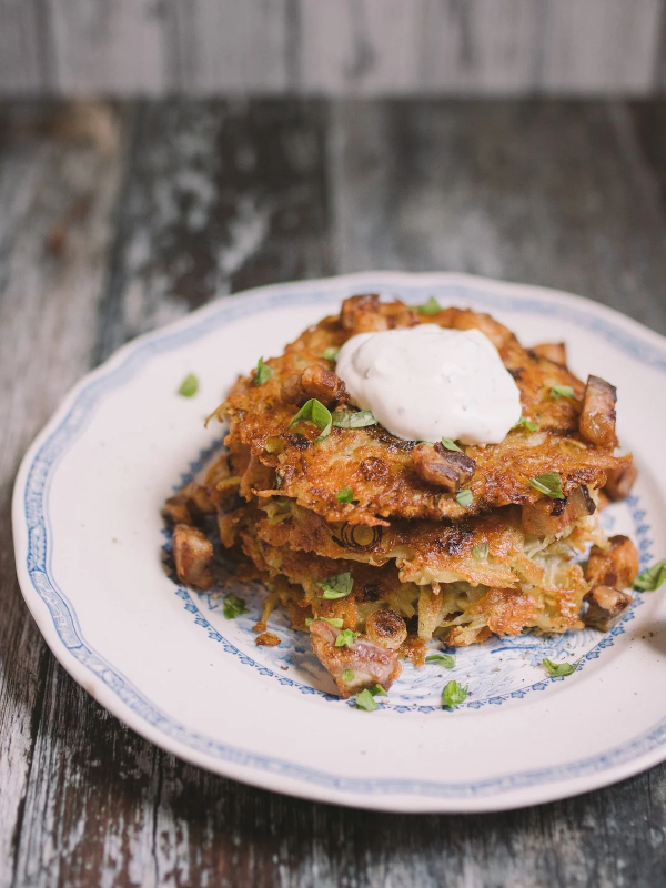 Crispy potato cakes with lardons, spring onion & cheddar